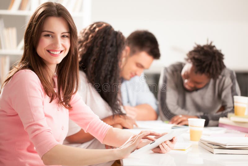 Smiling College Students Sitting Together Stock Photo - Image of ...