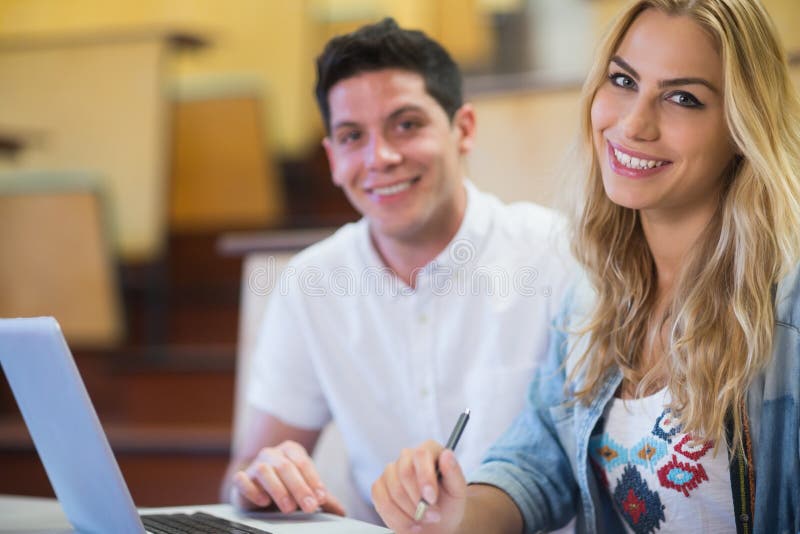 Smiling College Students Using Laptop Stock Photo - Image of casual ...