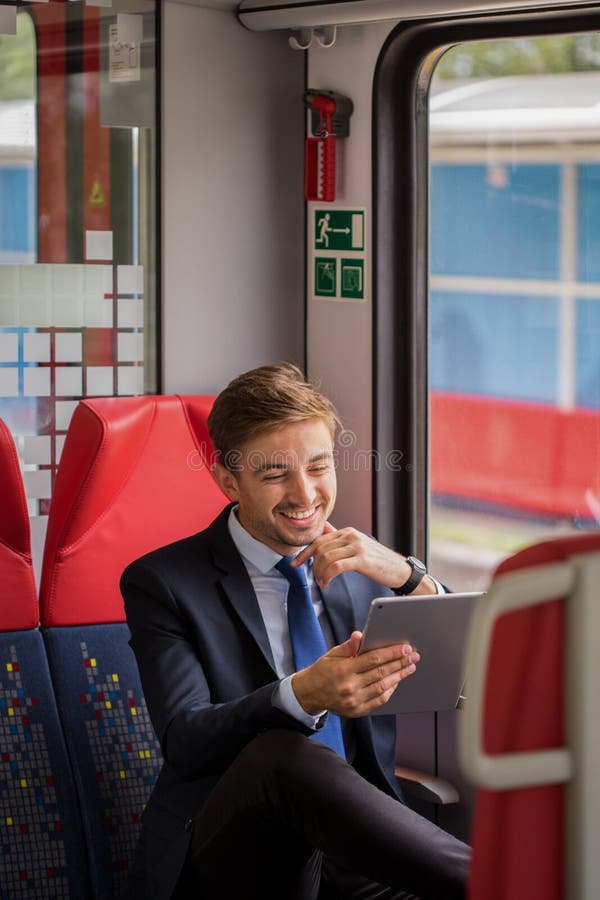 Smiling Commuter Standing in Train Stock Image - Image of fashion ...