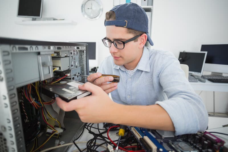 Smiling Computer Engineer Working on Broken Console with Screwdriver ...