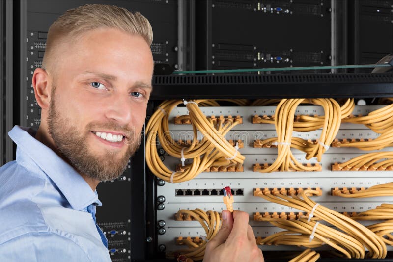 Smiling Computer Technician Stock Photo - Image of network, looking ...