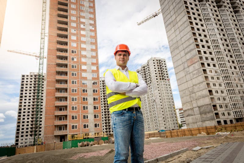 Smiling Confident Architect Standing at Buildings Under Construction ...