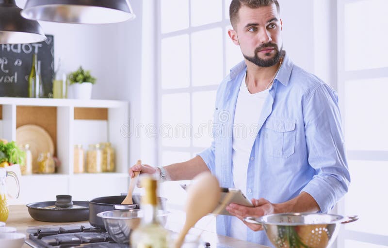 Smiling and Confident Chef Standing in Large Kitchen Stock Photo ...