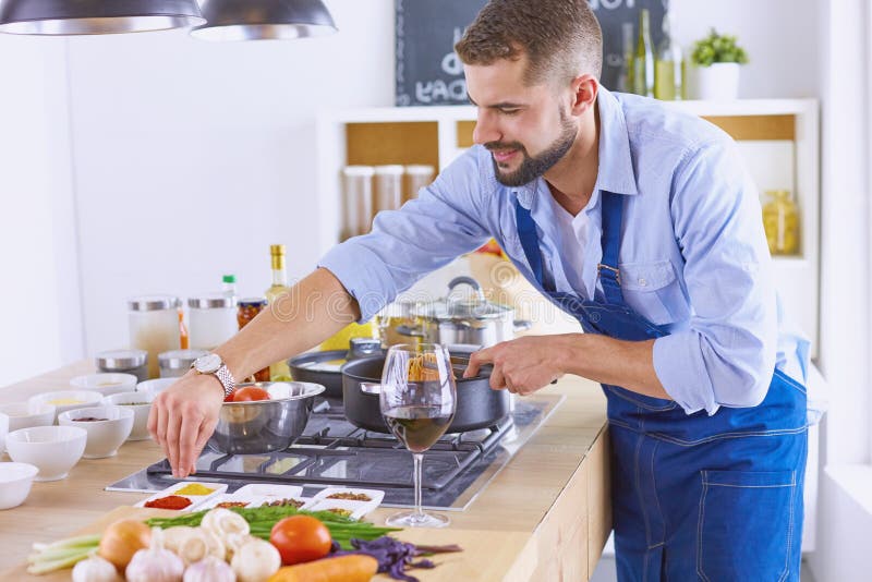 Smiling and Confident Chef Standing in Large Kitchen Stock Photo ...