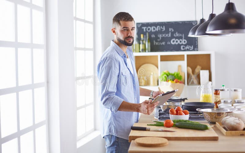 Smiling and Confident Chef Standing in Large Kitchen Stock Photo ...