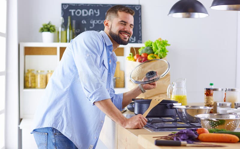 Smiling and Confident Chef Standing in Large Kitchen Stock Photo ...