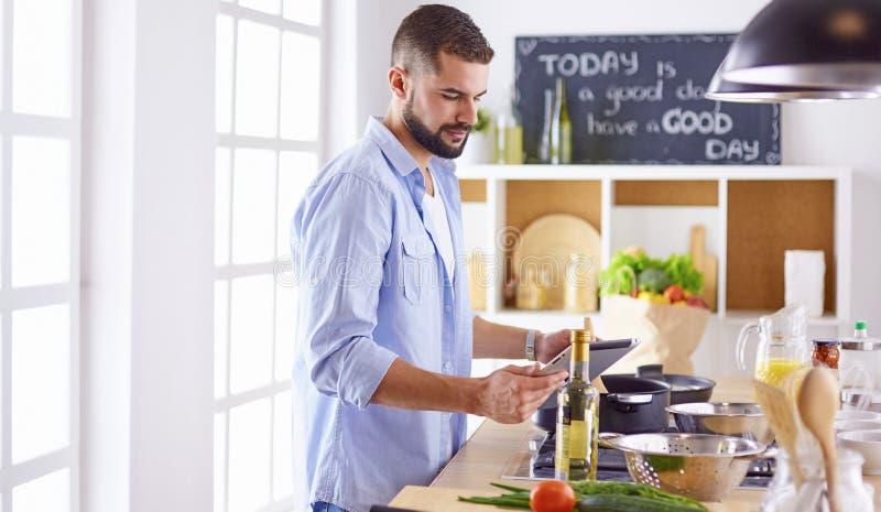Smiling and Confident Chef Standing in Large Kitchen Stock Photo ...