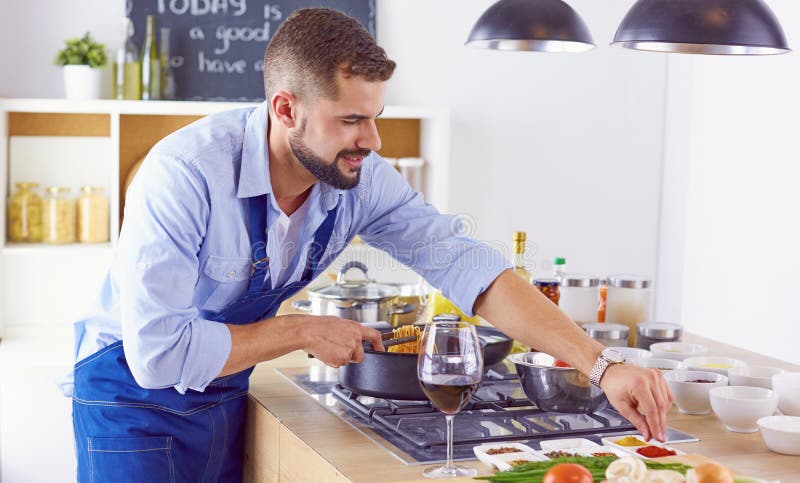 Smiling and Confident Chef Standing in Large Kitchen Stock Photo ...