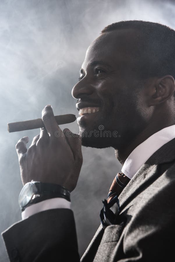Smiling Confident Man Smoking Cigar Indoors Stock Photo - Image of ...