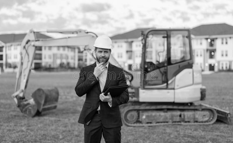Positive Engineer Men Walking at Construction Site. Engineer Men at ...