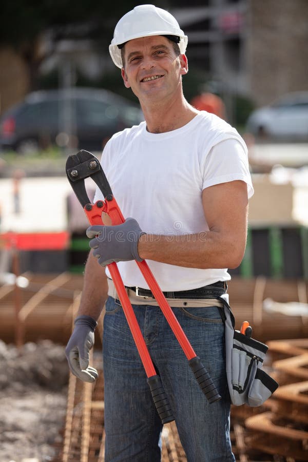 Smiling Construction Worker Stood by Window Stock Image - Image of ...