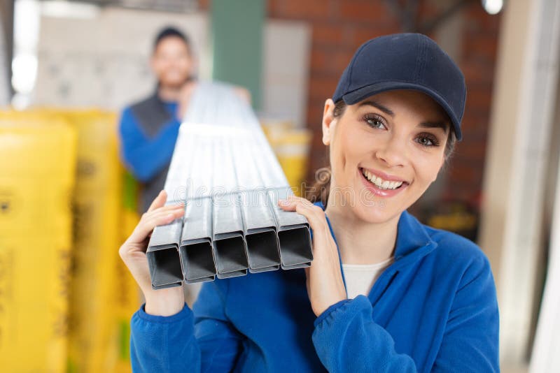 Smiling Construction Worker Carrying Metal Bar Stock Photo - Image of ...
