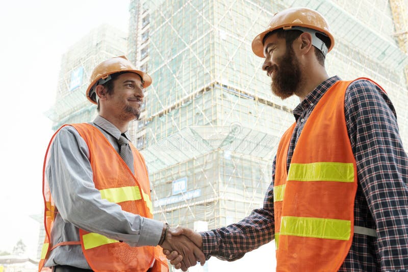 Construction Worker Shaking Hands Stock Image - Image of standing ...
