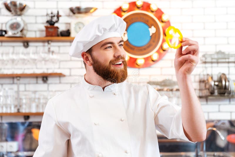 Smiling Cook Cheif Holding Slice of Yellow Bell Pepper Stock Image ...