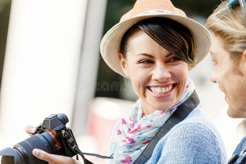 Smiling Couple with the Camera Stock Image - Image of camera ...