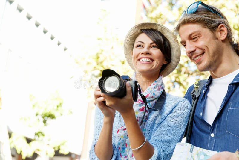 Smiling Couple with the Camera Stock Photo - Image of equipment ...