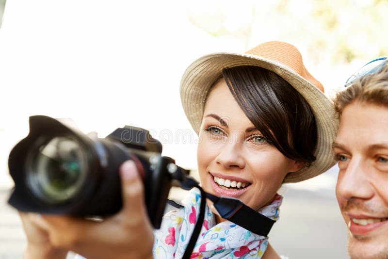 Smiling Couple with the Camera Stock Image - Image of outdoors ...