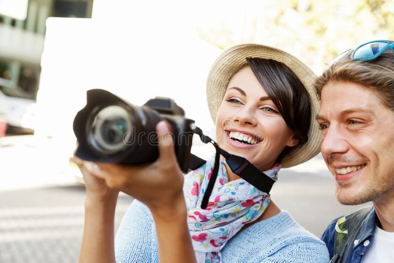 Smiling Couple with the Camera Stock Photo - Image of couple, equipment ...