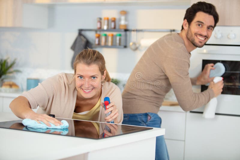 Smiling Couple Cleaning Kitchen Stock Photo - Image of domestic, couple ...