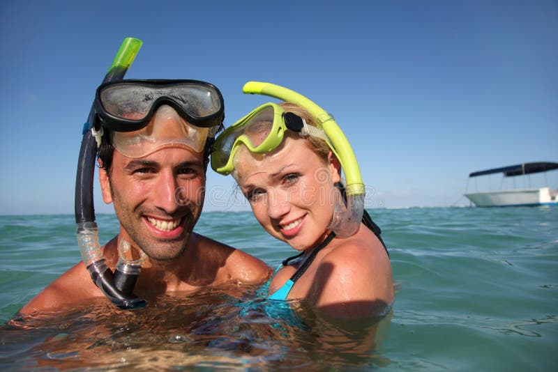 Couple with Scuba Diving Equipment Enjoying Beach Holiday Stock Image ...