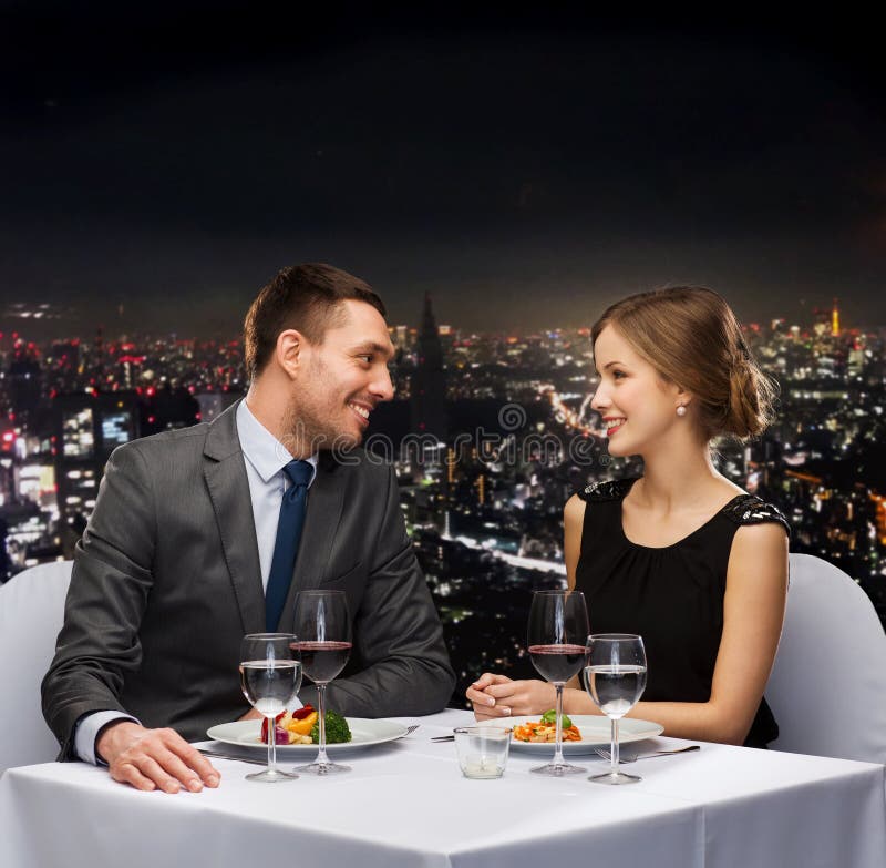 Smiling Couple Eating Main Course at Restaurant Stock Image - Image of ...