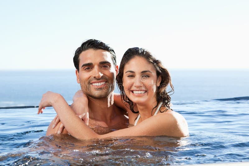 Couple Having Fun in Swimming Pool Stock Image - Image of couple ...