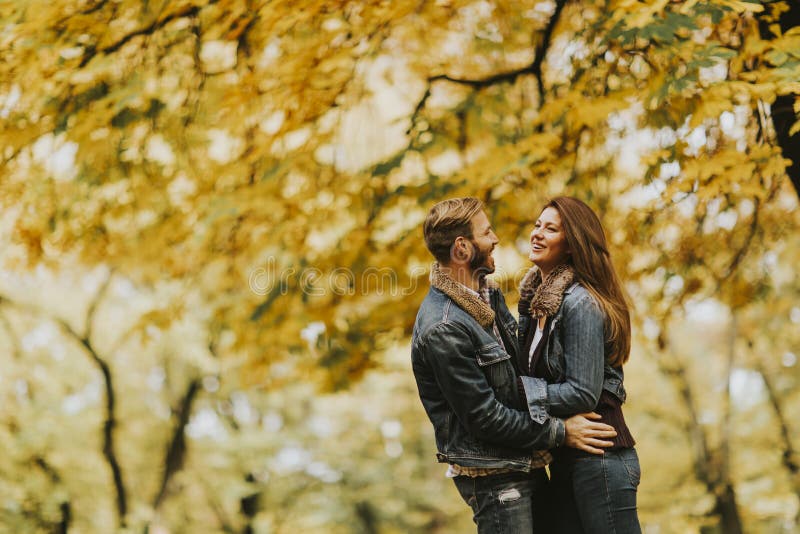 Smiling Couple Hugging in Autumn Park Stock Photo - Image of people ...