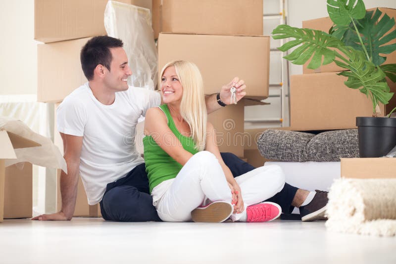 Happy Couple Moving To New Home Smiling Stock Image - Image of embrace ...