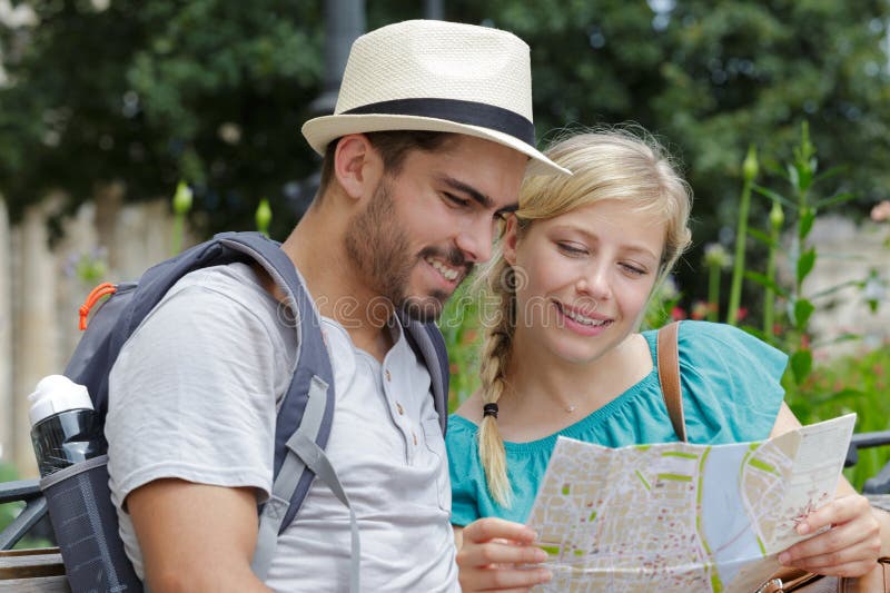 Smiling Couple with Map and Backpack Stock Photo - Image of travelers ...
