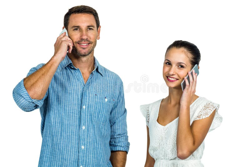 Smiling Couple on Phone Call Looking at the Camera Stock Image - Image ...