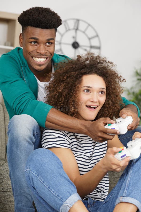 Smiling man playing games stock photo. Image of domestic - 24016596