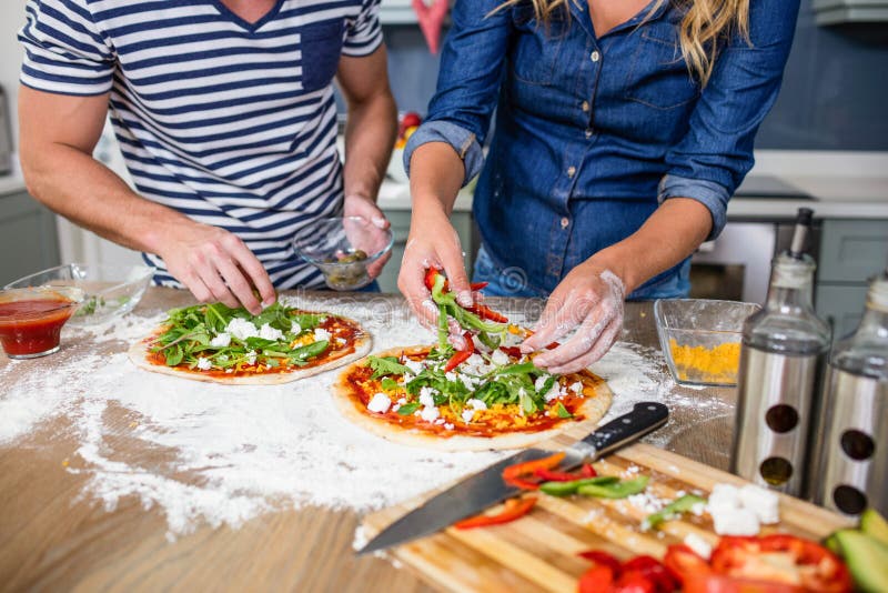 Smiling Couple Preparing Pizza Stock Photo - Image of closeness ...