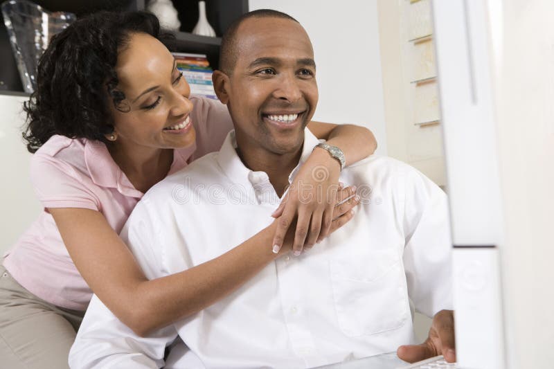 Smiling Couple Using Computer Stock Image - Image of lifestyle, leisure ...
