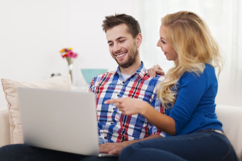 Smiling Couple Using Laptop Stock Image - Image of purity, laptop: 36395277