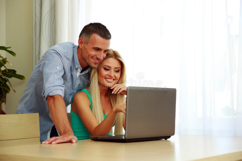Couple Using Laptop Computer Stock Image - Image of credit, furniture ...
