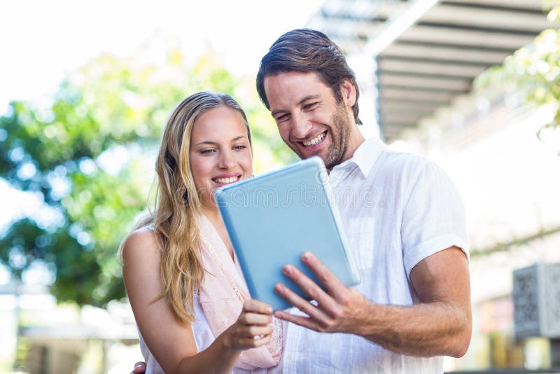 Smiling Couple Using Tablet Computer Stock Photo - Image of computer ...