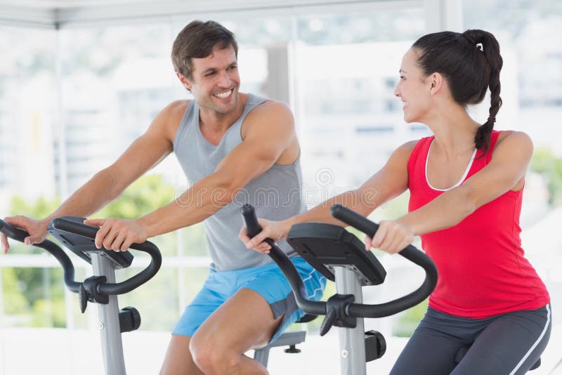 Smiling Couple Working Out at Spinning Class Stock Photo - Image of ...