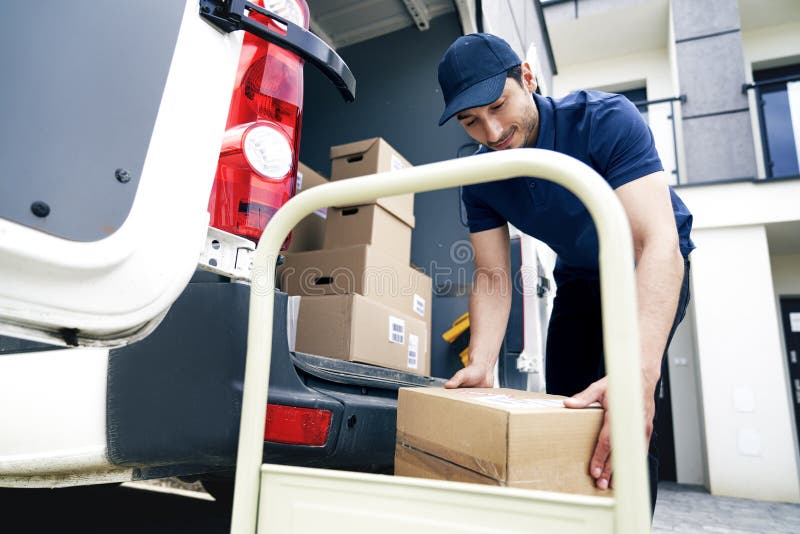 Delivery man at work stock photo. Image of packaging - 224811436