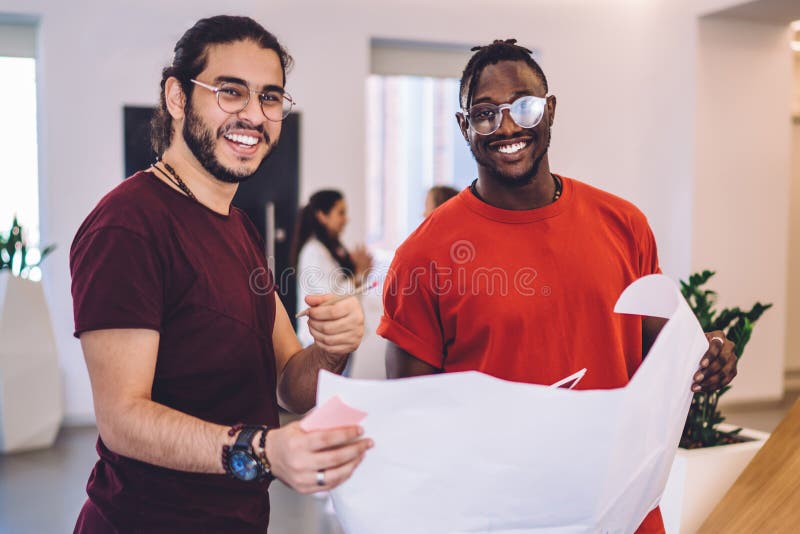 Smiling Creative Men with Paper Draft Stock Photo - Image of ...