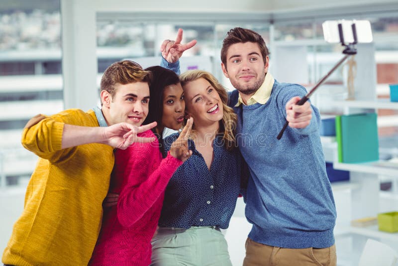 Smiling Creative Team Posing for a Selfie Stock Photo - Image of ...