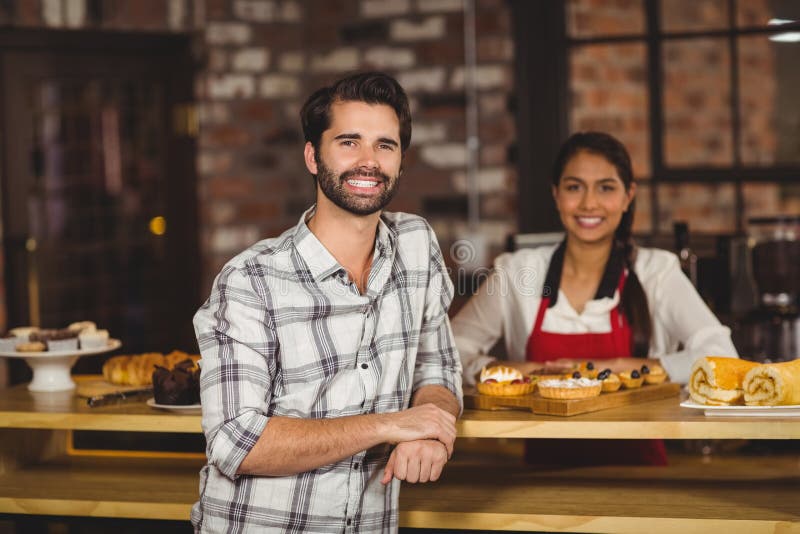 Smiling Customer Leaning on the Counter Stock Photo - Image of male ...
