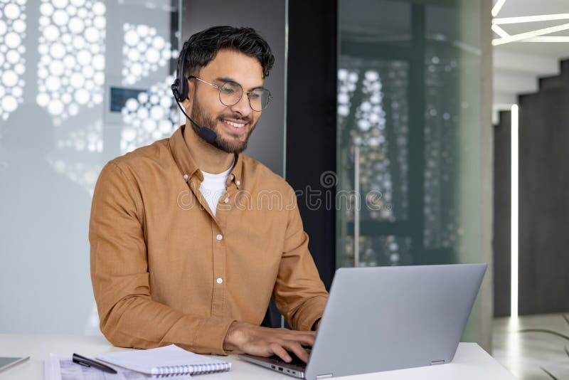 Smiling Customer Service Representative Working at Laptop with Headset ...