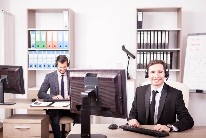 Smiling Customer Service Support Working in the Office Stock Photo ...