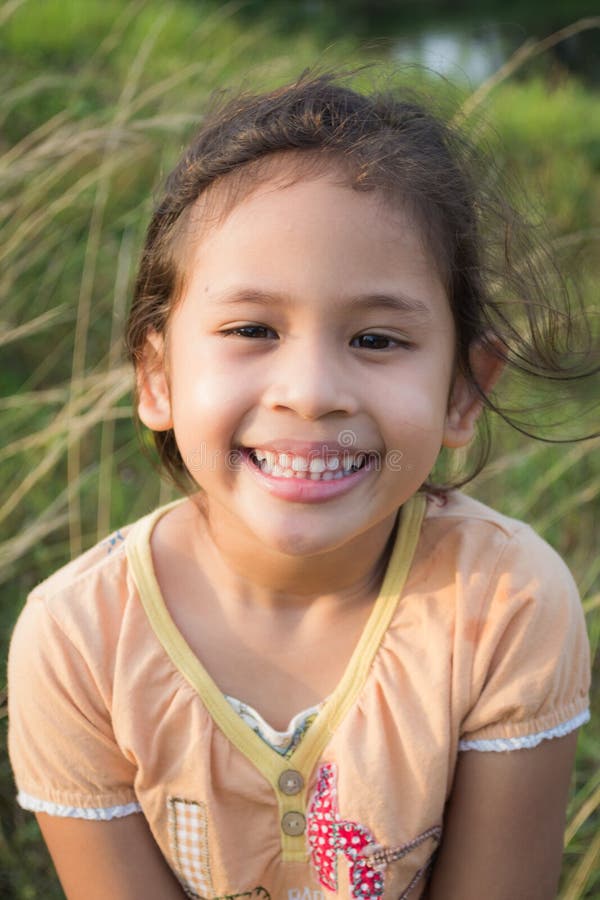 A Smiling Cute Girl on the Field Stock Image - Image of girl, joyful ...