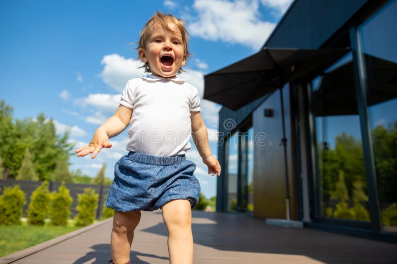 Smiling Cute Kid Walking and Looking Excited Stock Photo - Image of ...