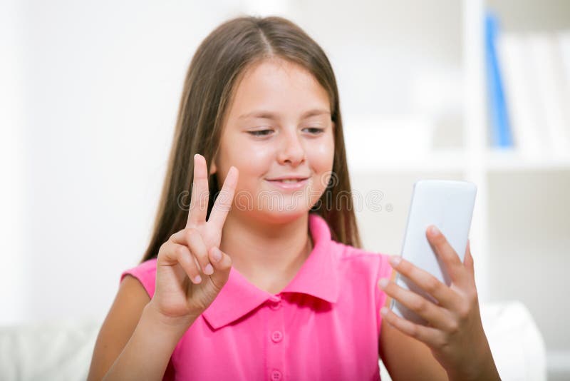 Smiling Deaf Girl Talking Using Sign Language on the Smartphone Stock ...
