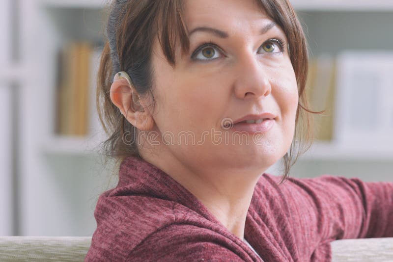 Deaf Woman Wearing Hearing Aid Stock Image - Image of caucasian, female ...