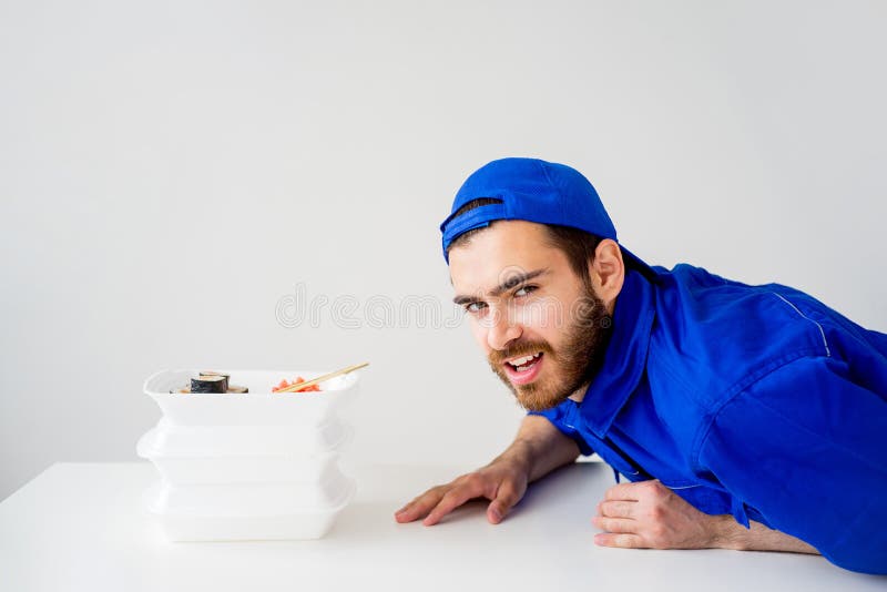Smiling delivery guy stock photo. Image of dinner, away - 97872920