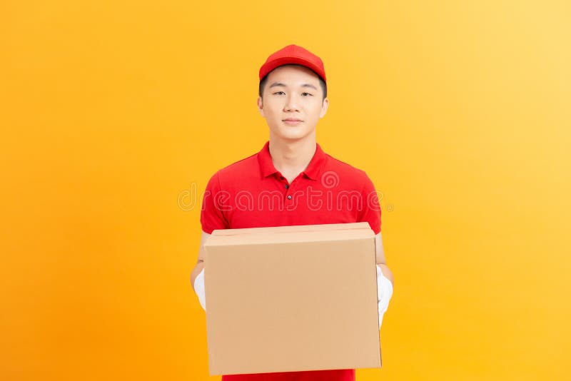 Smiling Delivery Man Carrying a Parcel Box Stock Photo - Image of ...