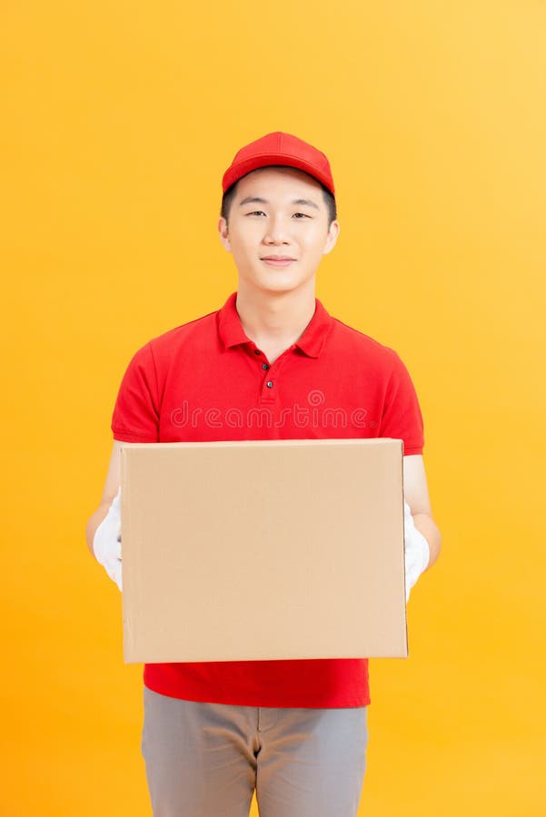 Smiling Delivery Man Carrying a Parcel Box Stock Photo - Image of ...